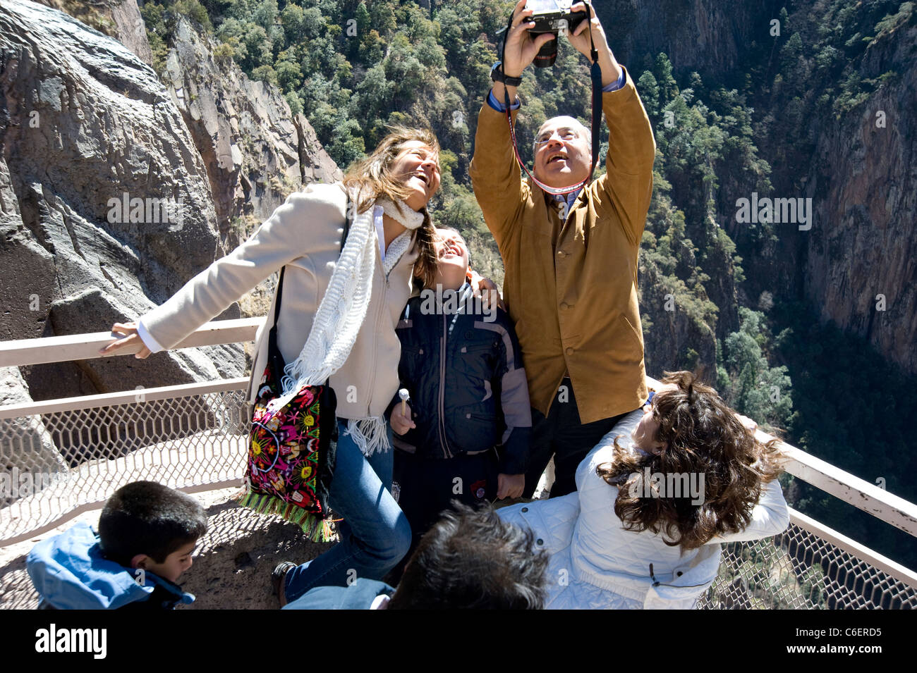 President Felipe Calderon of Mexico takes a photo of his family at the ...