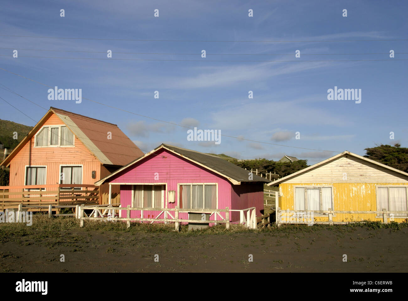 Colorful rustic beach cabanas in the small seaside retreat. Boca Budi ...