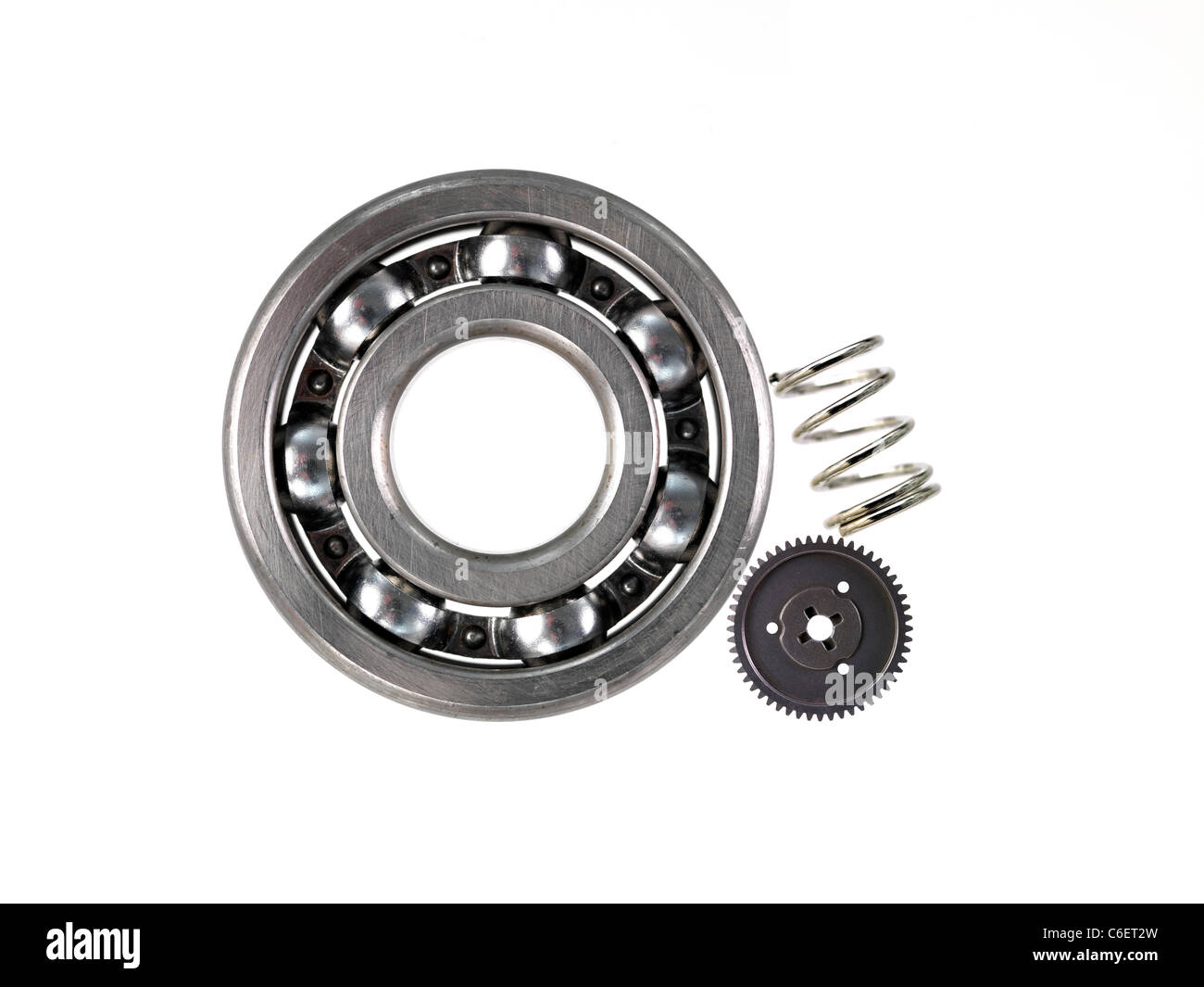A bearing spring and gear isolated against a white background Stock ...