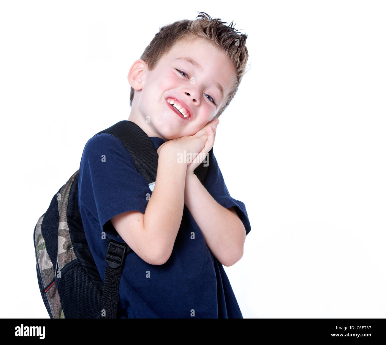 A young boy with backpack studio portrait Stock Photo - Alamy