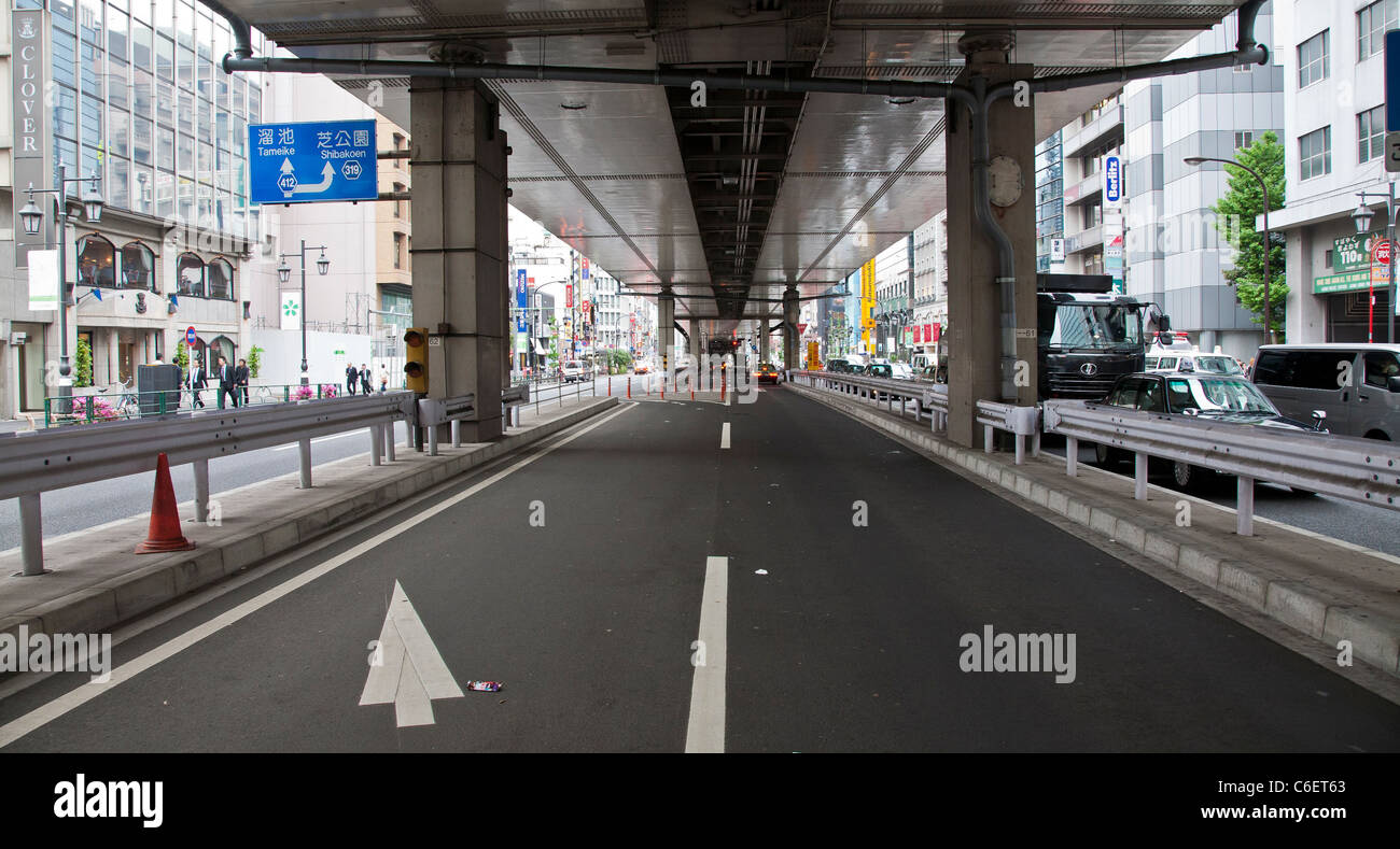 The road underneath an elevated highway in Tokyo Stock Photo - Alamy