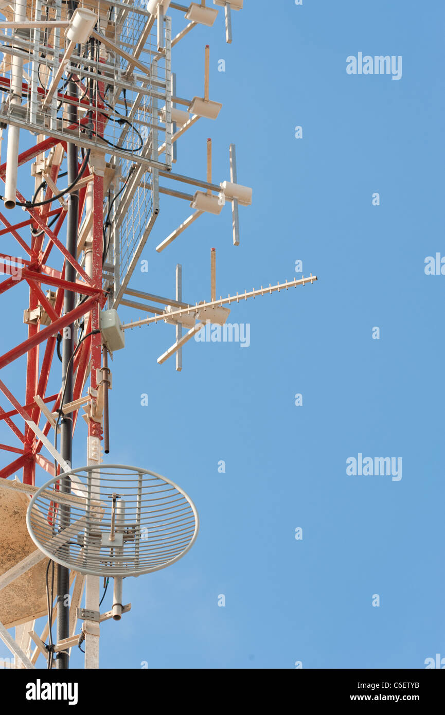 Telecom mast with multiple uses against blue sky background Stock Photo ...