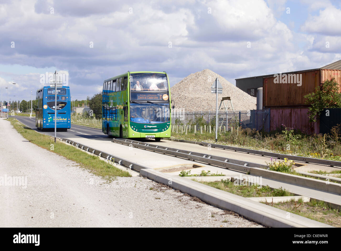 Two buses joining and leaving Cambridge Guided Busway at St Ives Stock ...