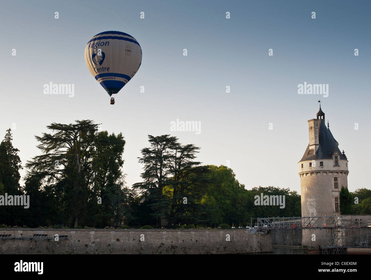 Hot air balloon flying over Chenonceau chateau on the River Cher France ...