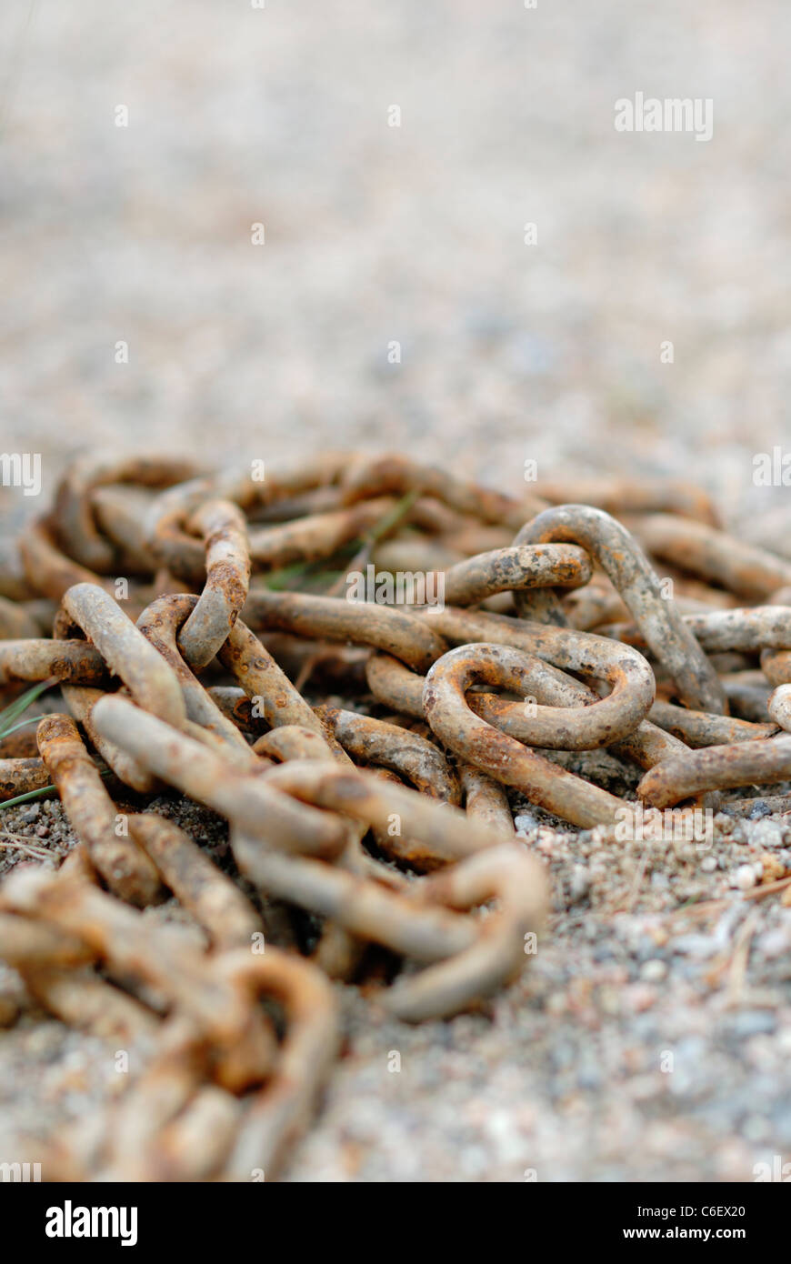 Rusty chain in sand, selective focus Stock Photo - Alamy