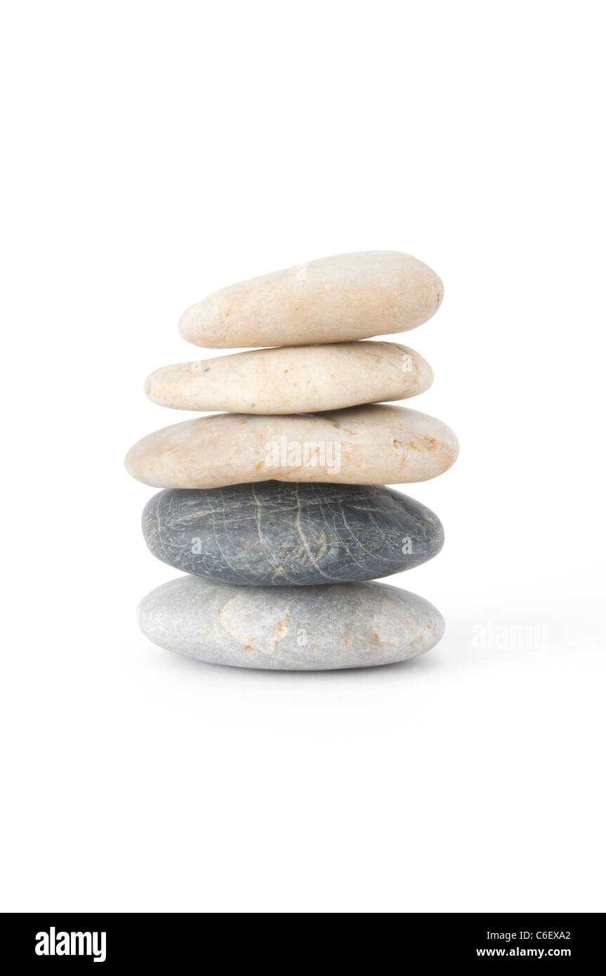 Five pebbles arranged to illustrate perfect balance Stock Photo - Alamy