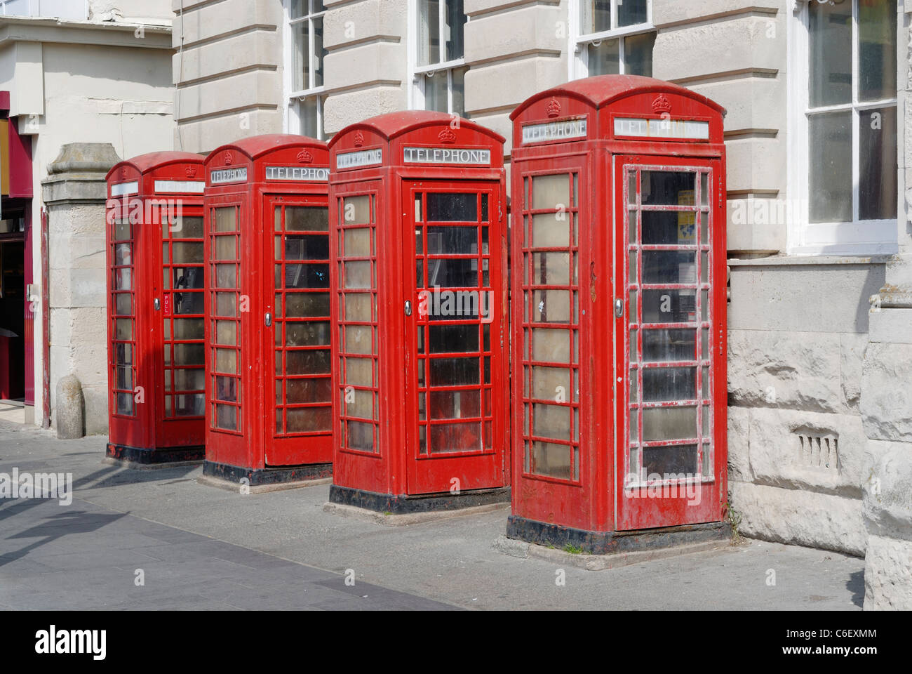 Row of traditional red phone boxes in Blackpool Stock Photo - Alamy