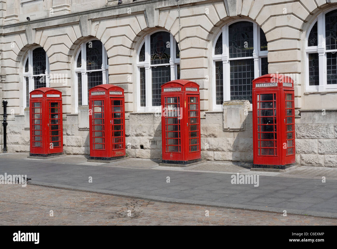 Row of traditional red phone boxes in Blackpool Stock Photo - Alamy