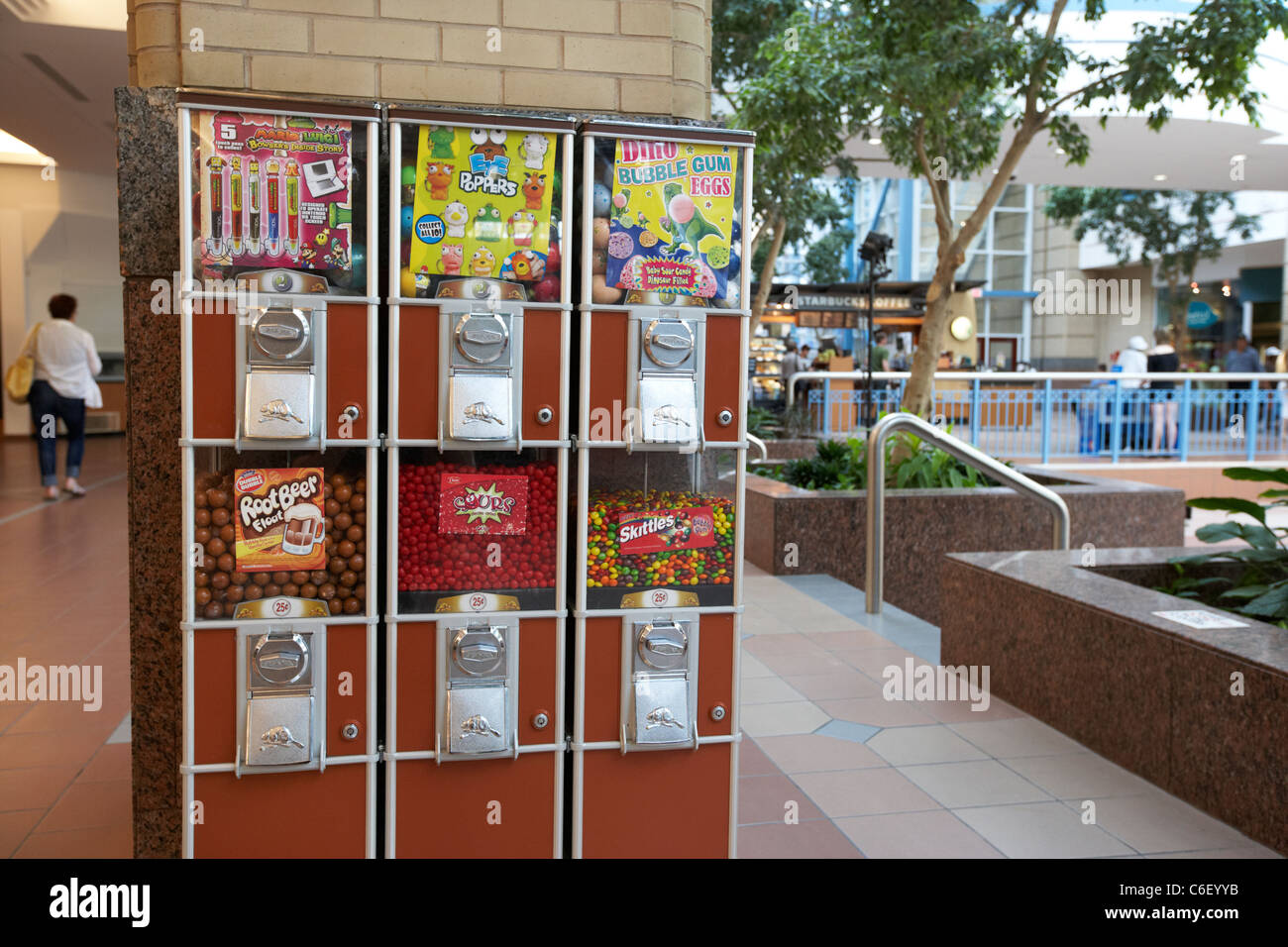 candy sweets coin operated dispensers in a shopping centre mall ...