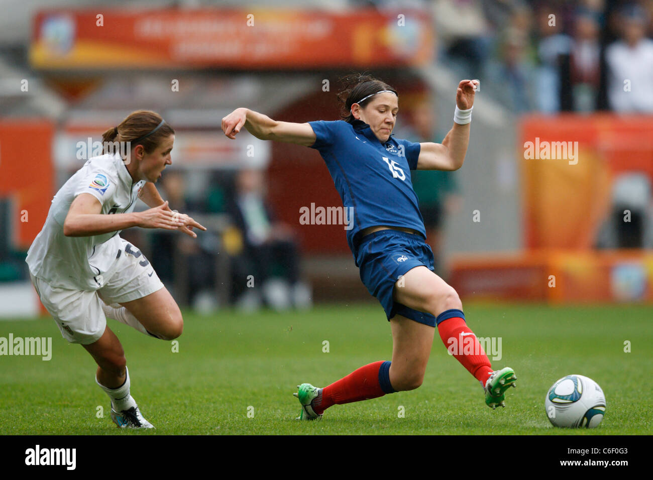 Elise Bussaglia of France (r) stretches for the ball ahead of Heather O ...