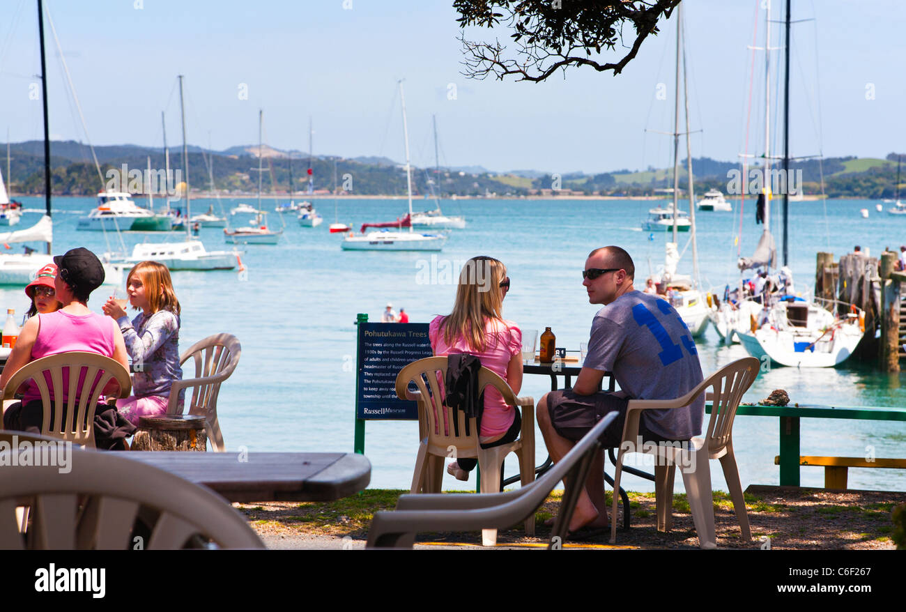 People sitting at a waterfront cafe, Russell, Bay of Islands, Northland ...