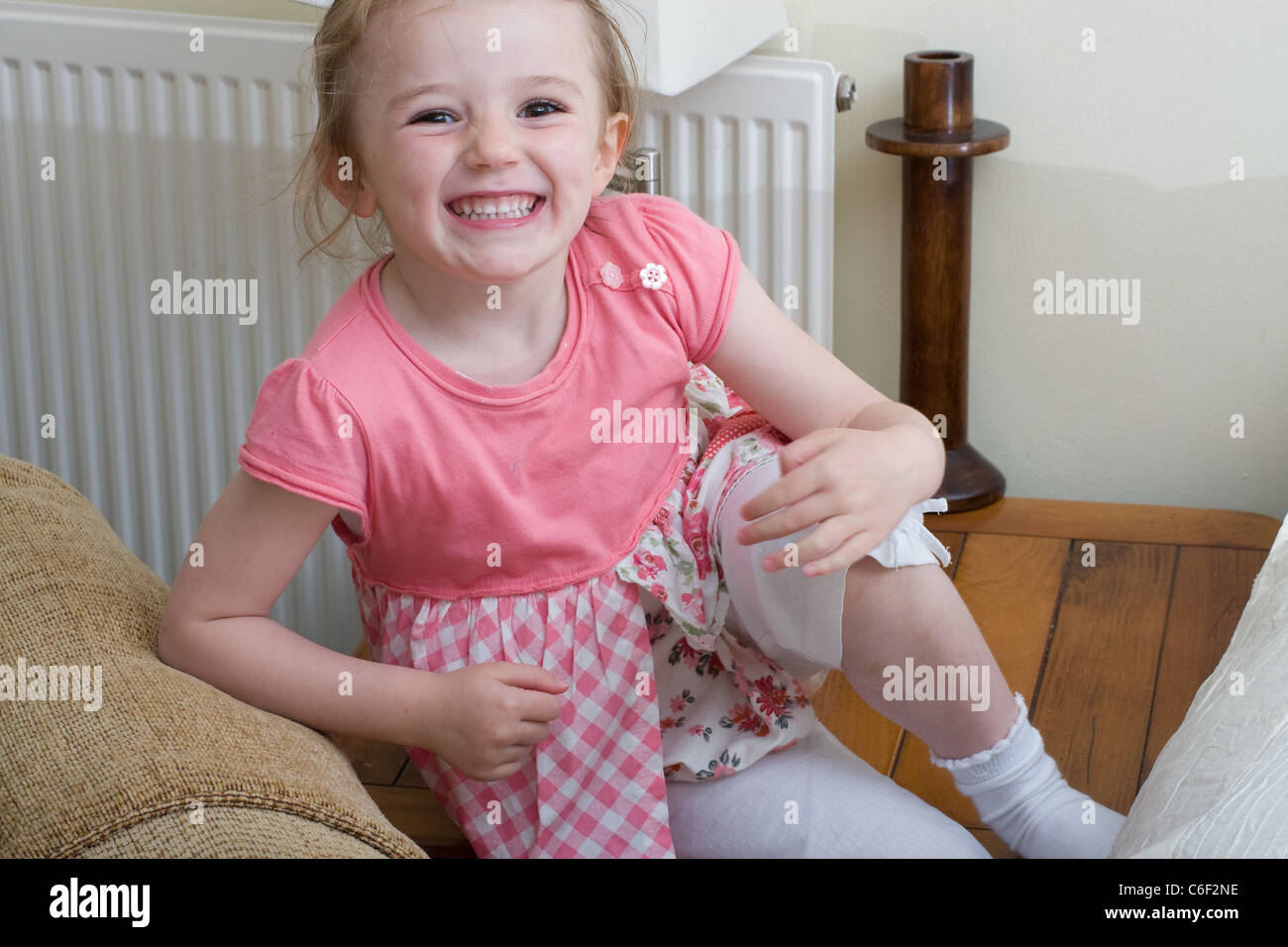 young toddler girl sister laughing jumping jump Stock Photo - Alamy