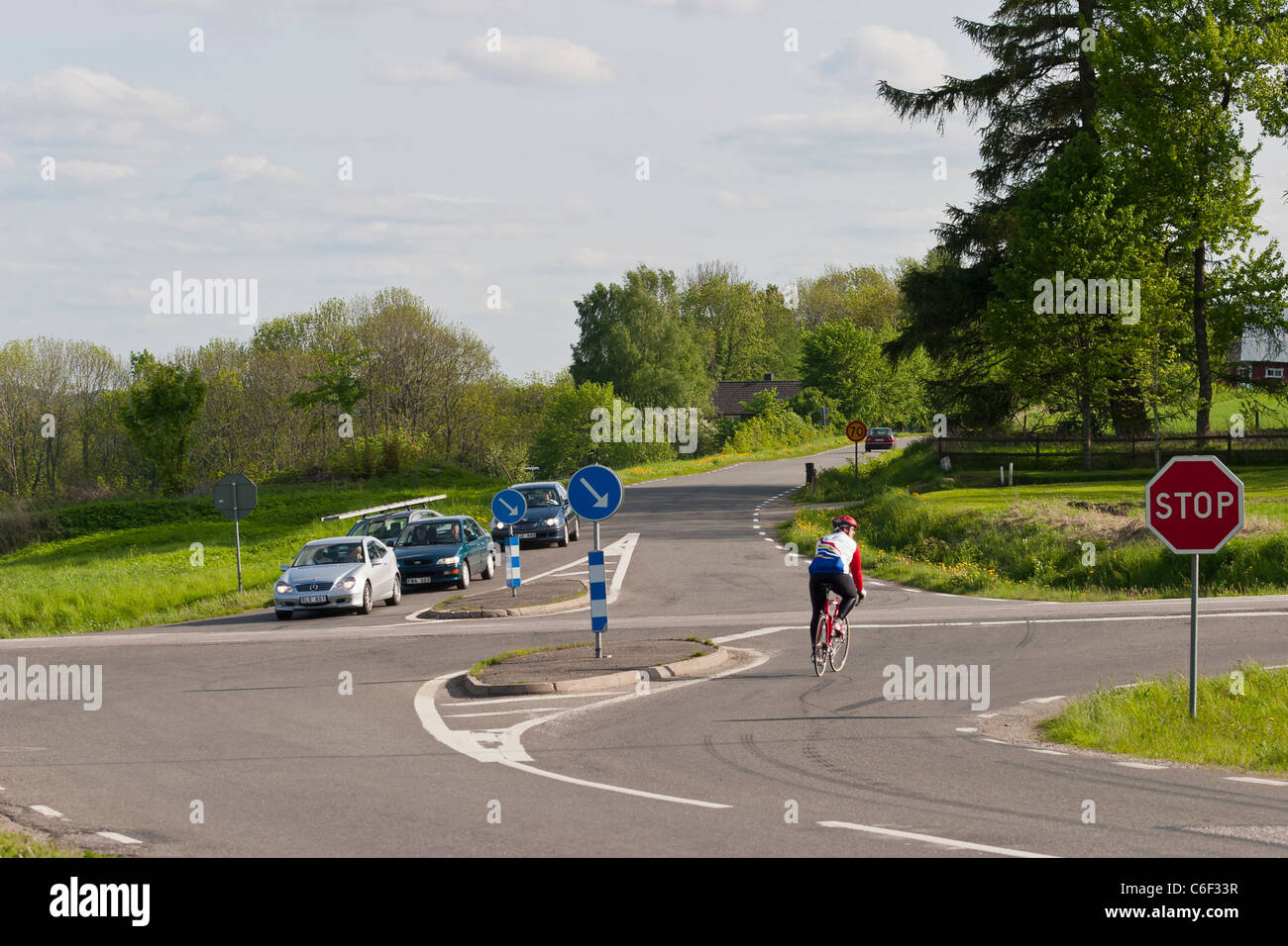 Intersection with the cyclists and cars Stock Photo - Alamy