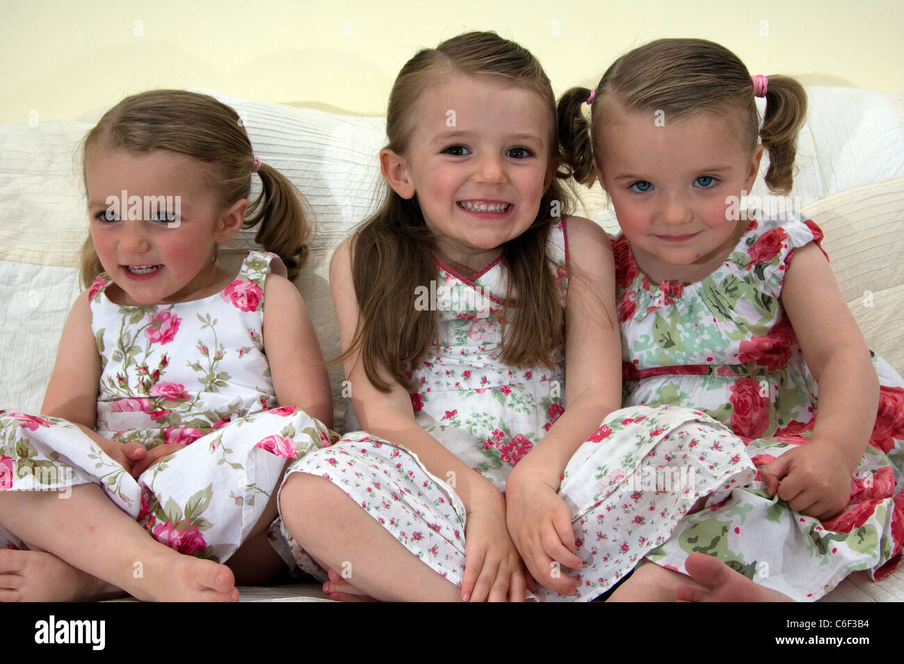 young toddler girls sisters smile twins happy Stock Photo - Alamy