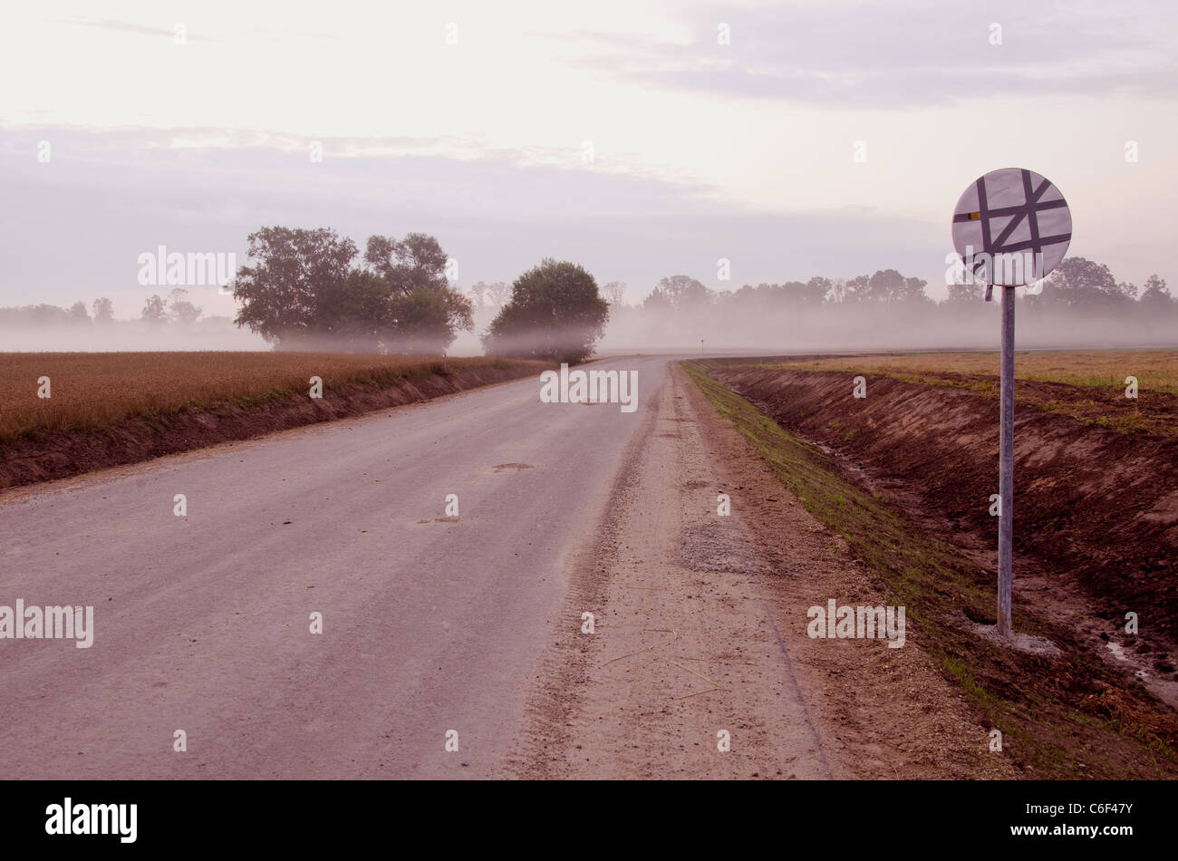 early summer morning mist and road Stock Photo - Alamy