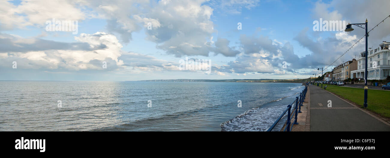 Filey promenade looking South towards the Chalk cliffs of Bempton and ...