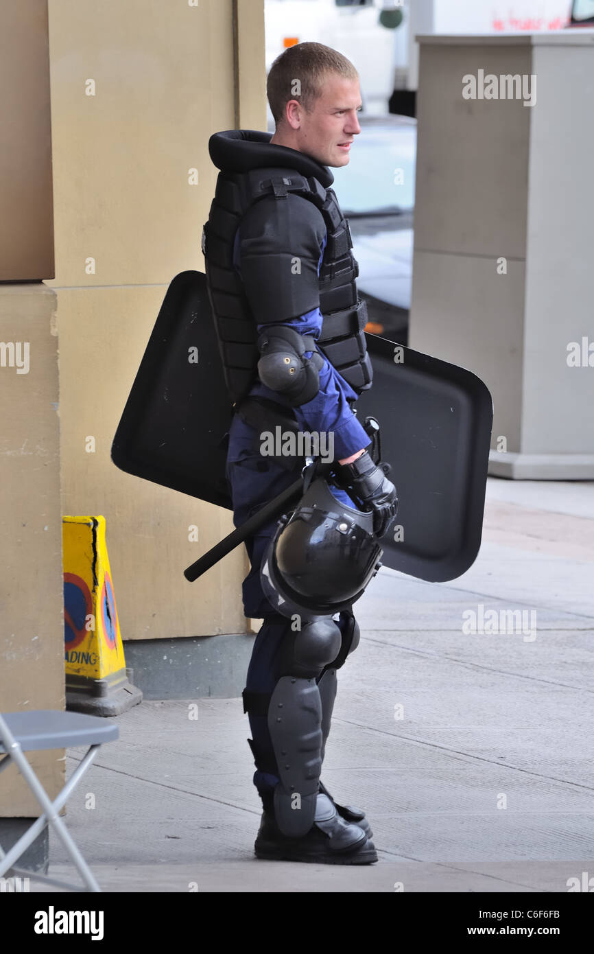 Young actor dressed in riot gear for the filming of World war Z in ...