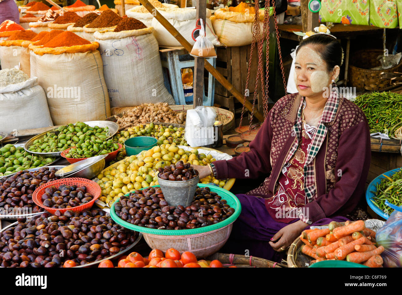 Woman selling produce in market, Bago (Pegu), Myanmar (Burma Stock ...