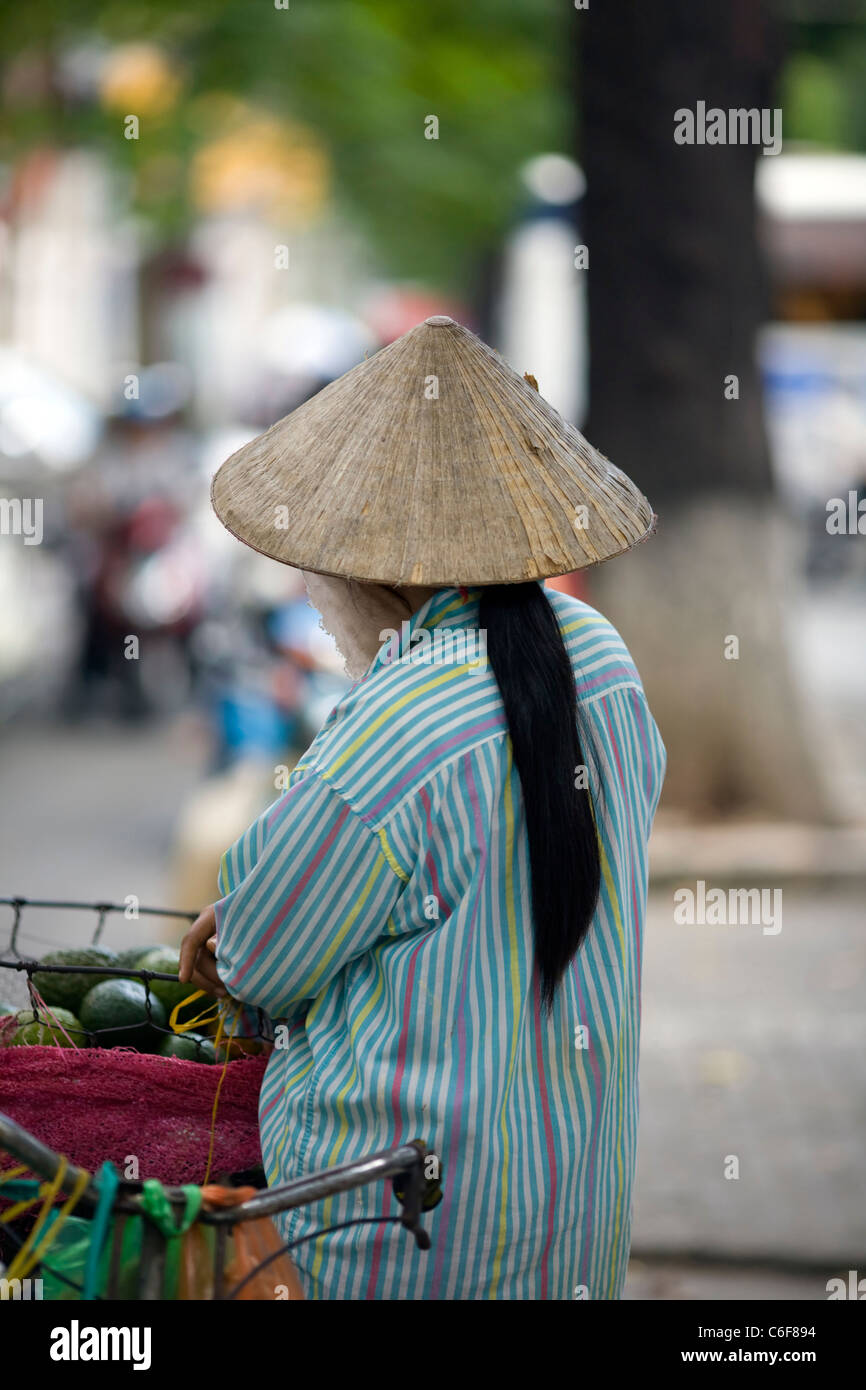 Woman with conical hat hi-res stock photography and images - Alamy
