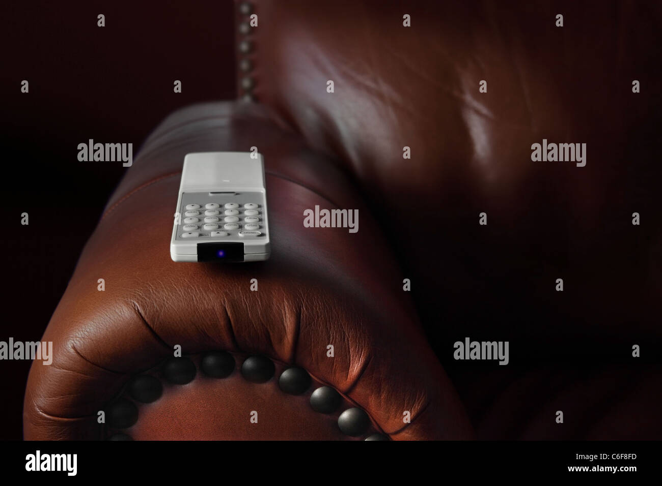 Remote control placed on couch hi-res stock photography and images - Alamy