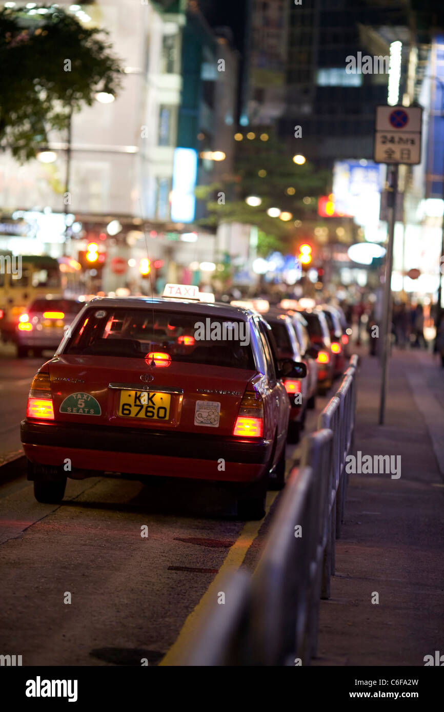 Taxi's in a line at night Stock Photo - Alamy