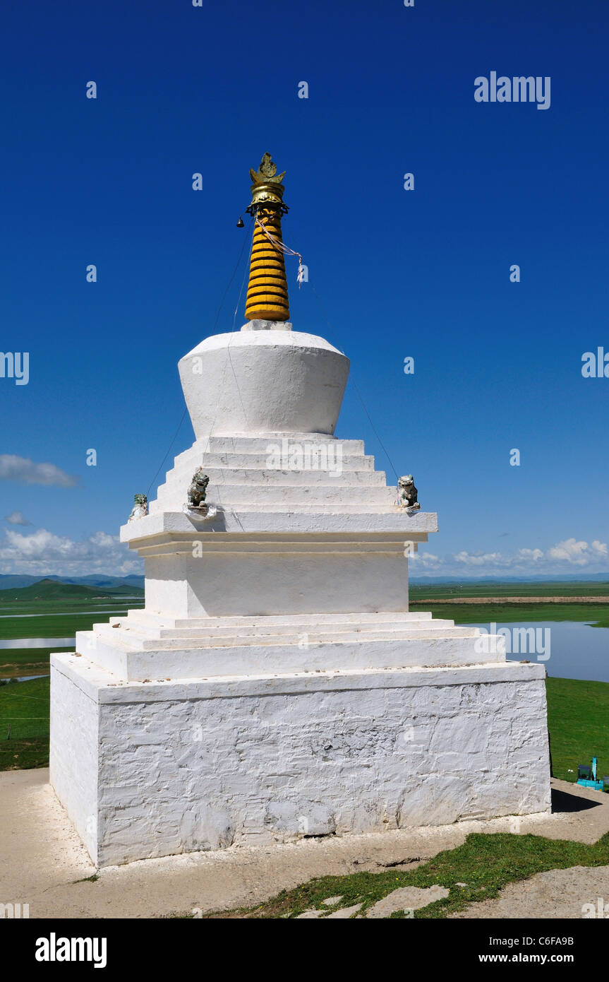 A Tibetan Buddhist stupa stands against blue sky. Sichuan, China Stock ...