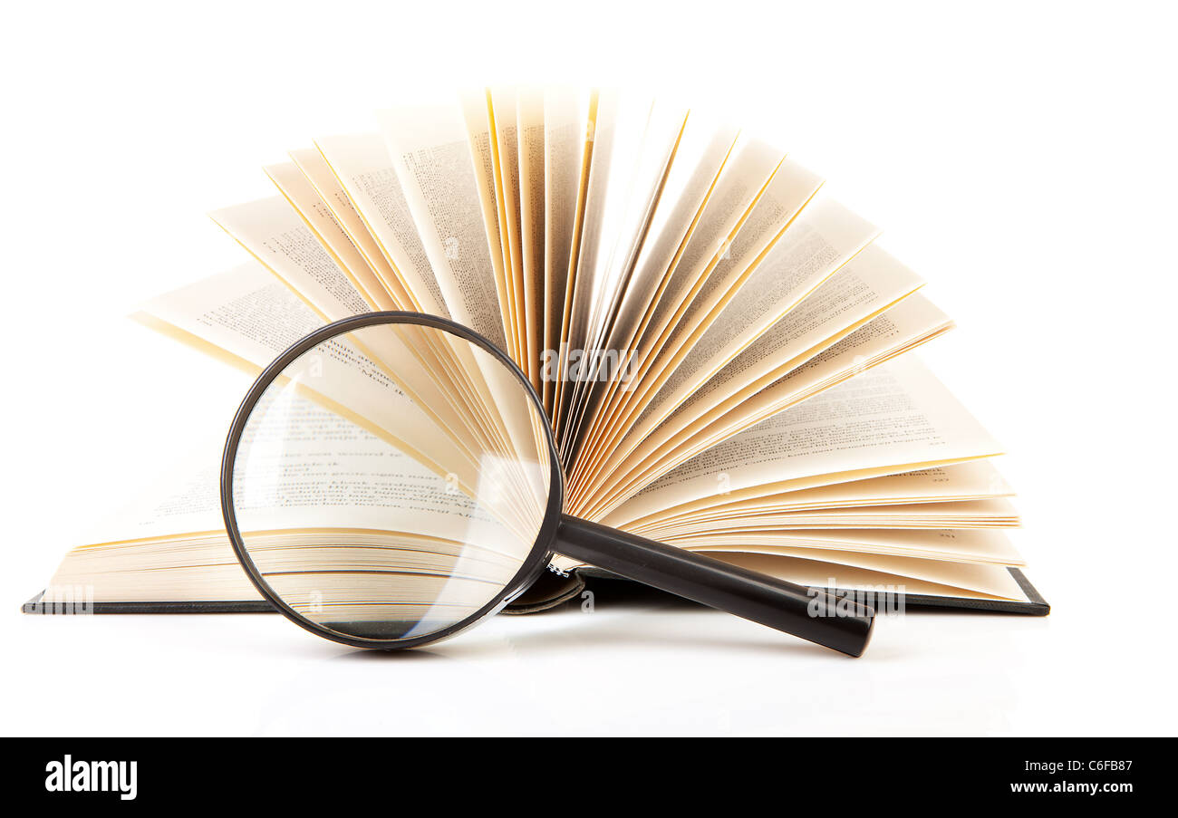 open book with magnifying glass over white background Stock Photo - Alamy