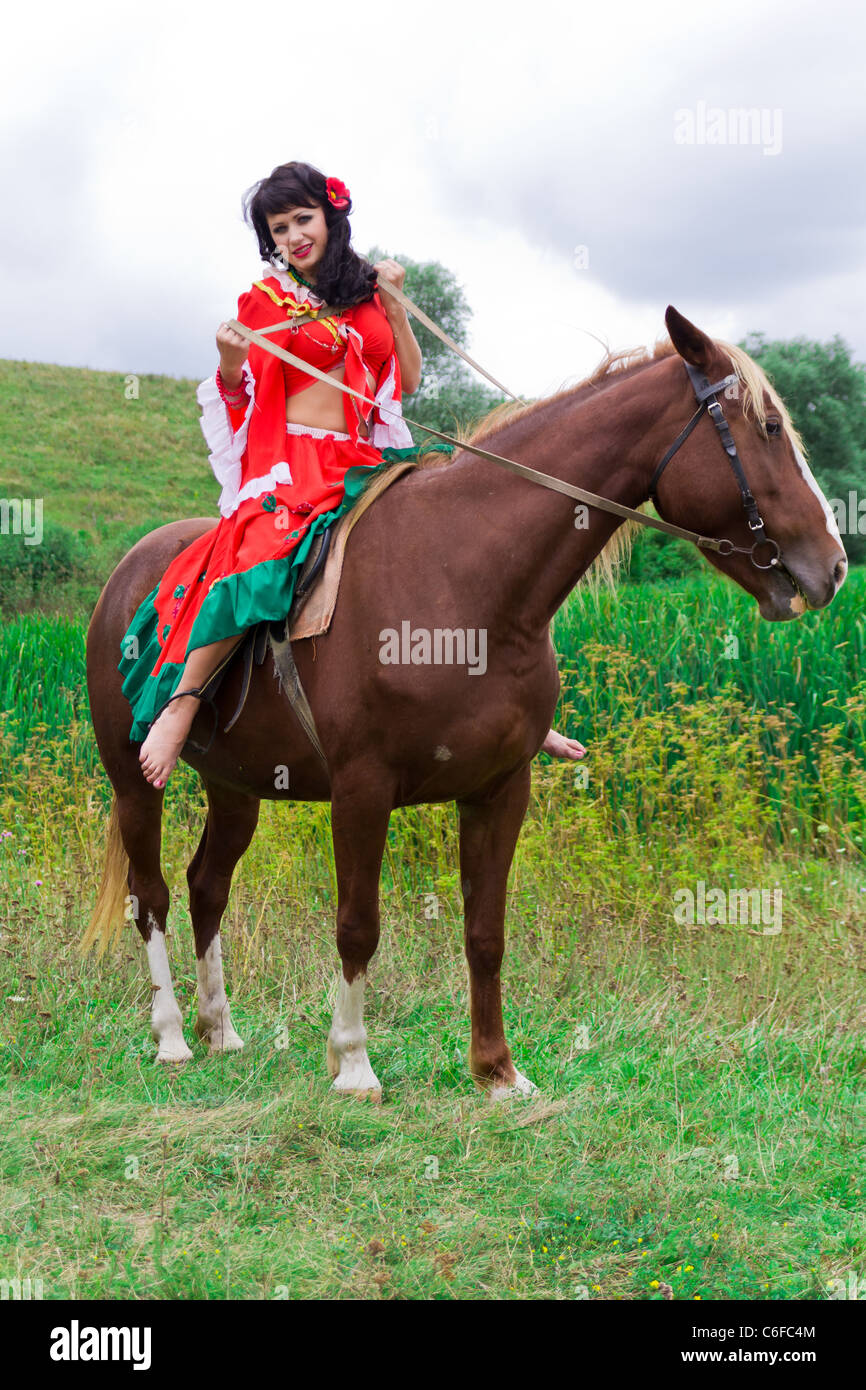 Beautiful gypsy girl riding horse hi-res stock photography and images ...