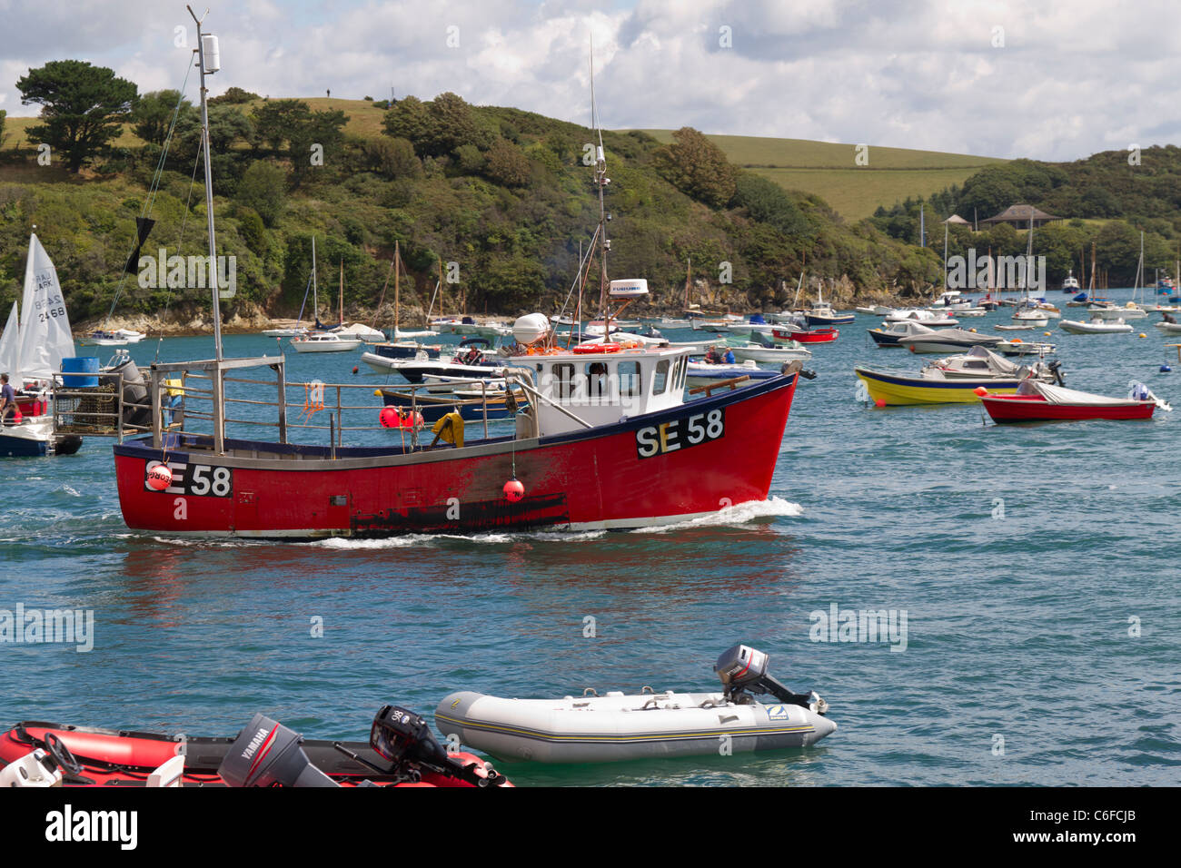 Small fishing boat sailing up the Salcombe estuary Stock Photo - Alamy