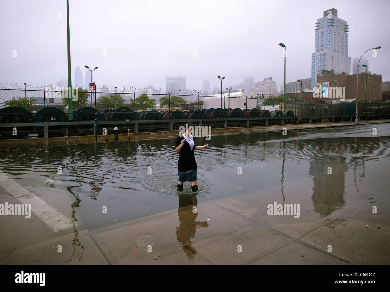 Woman in flooding on Twelfth Avenue in the Chelsea neighborhood in New ...