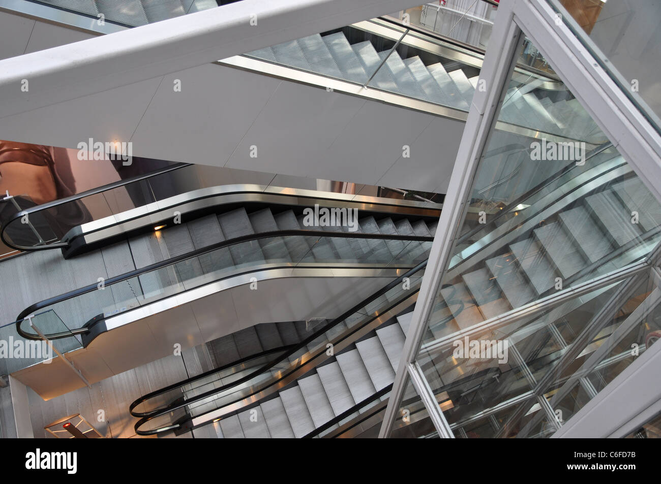 Escalators in a huge building between floors Stock Photo - Alamy