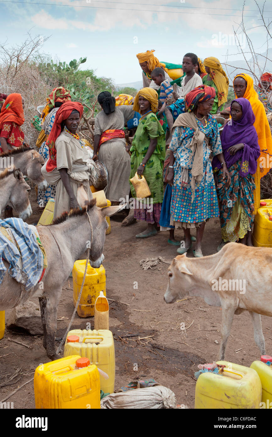 Oromo tribespeople gather at a well to collect water in the Chercher ...