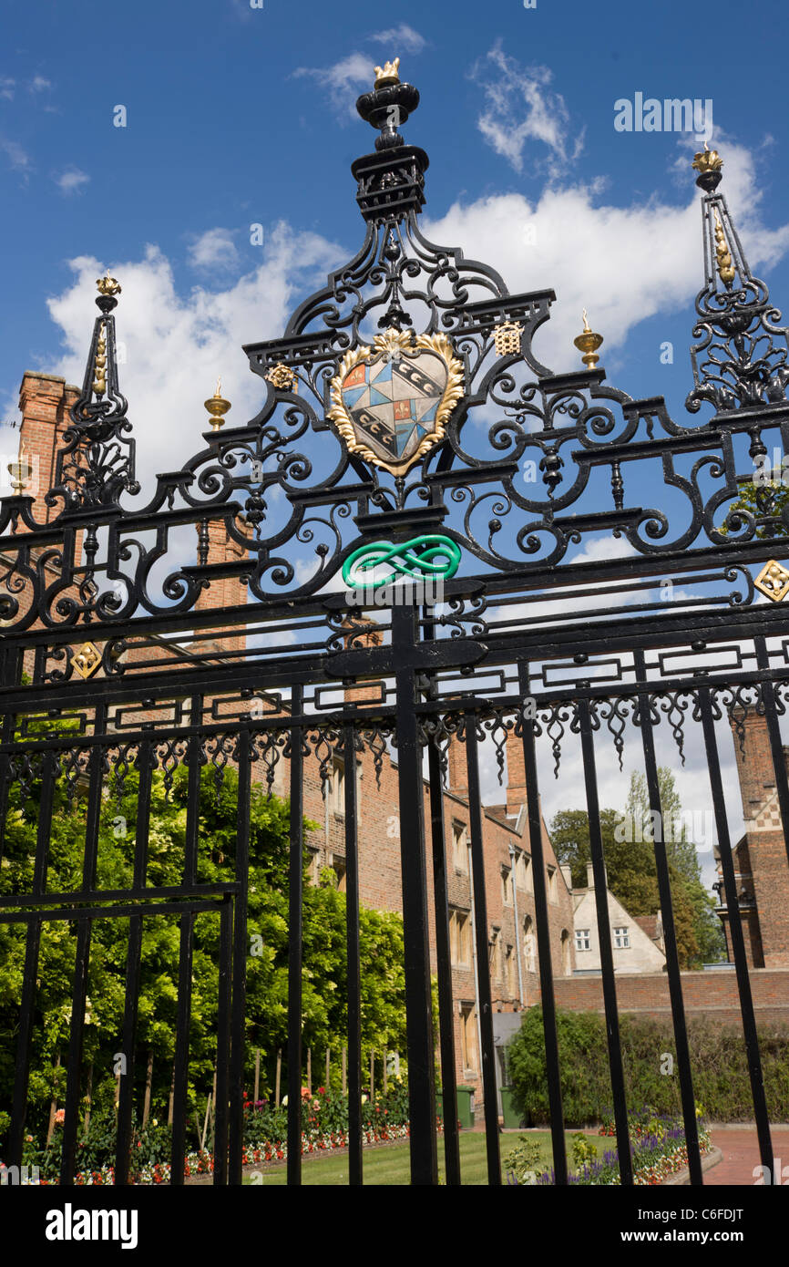Looking up at the tall wrought iron gates of Magdalene College, a ...