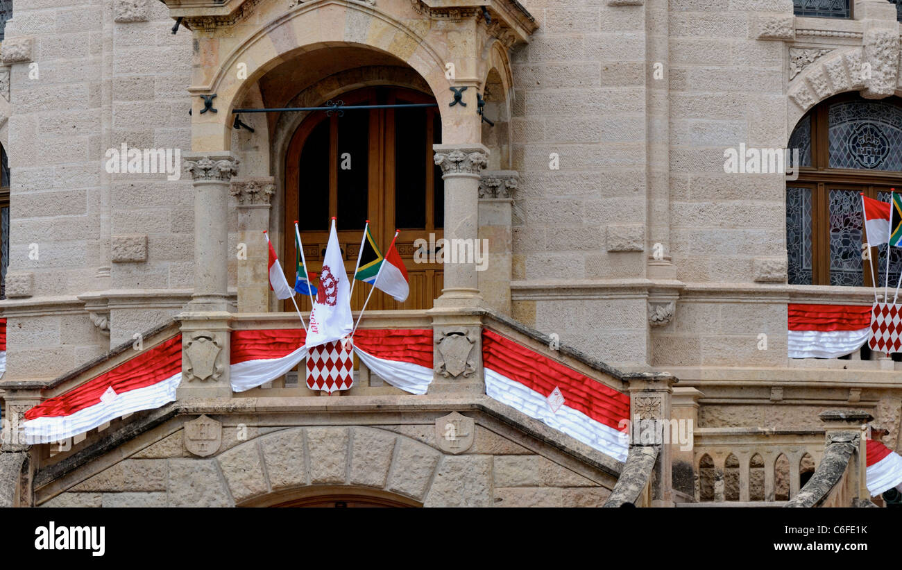 Exterior of Monaco's courthouse with flags of Monaco and South Africa ...