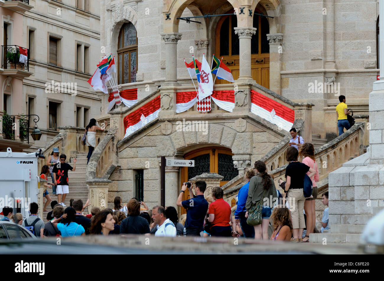 Exterior of Monaco's courthouse with flags of Monaco and South Africa ...
