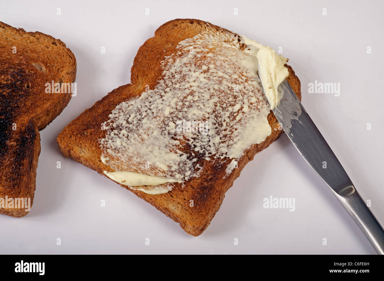 Brown wholemeal bread buttered toast Stock Photo - Alamy