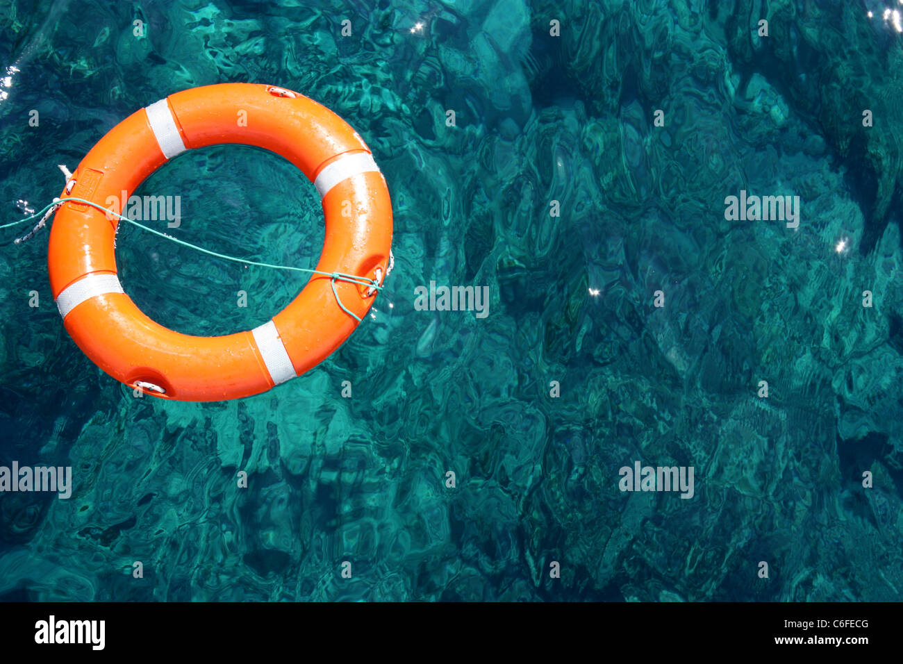 a rubber ring floating on water Stock Photo - Alamy