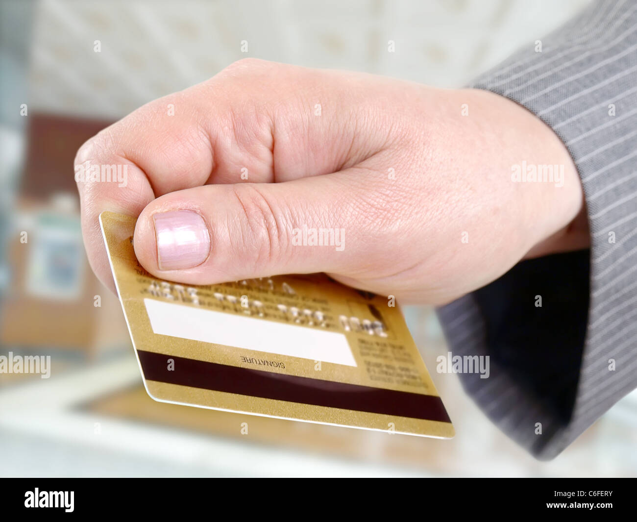 Hand with credit card Stock Photo - Alamy