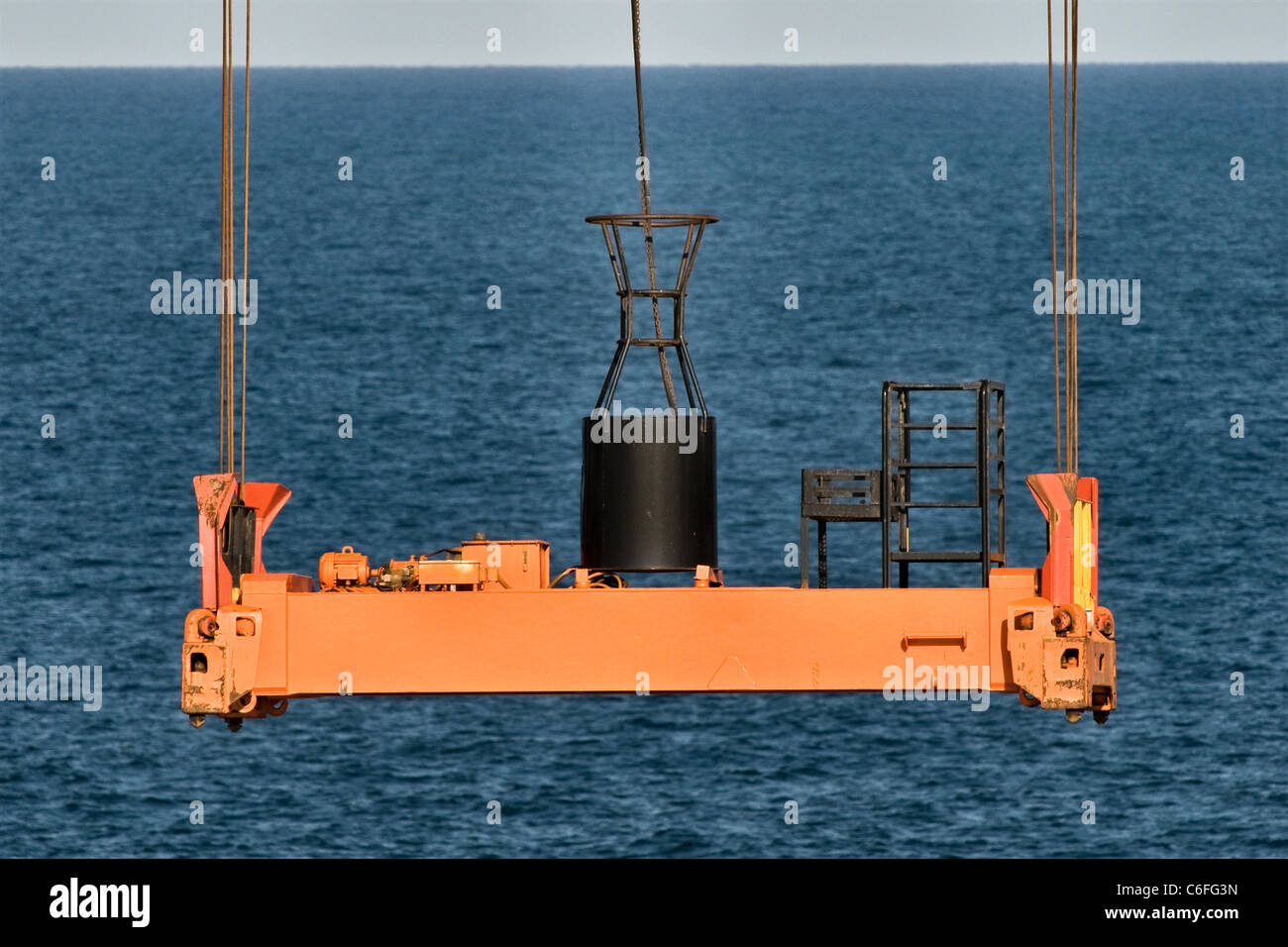 Sea port crane container grabber lift, dock Stock Photo - Alamy