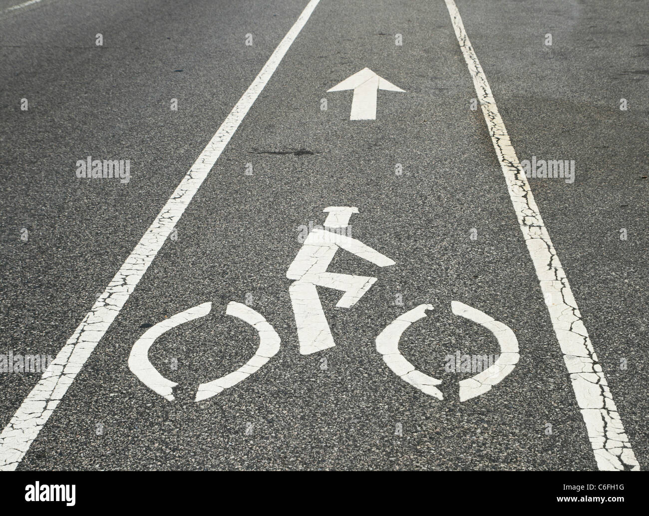 bicycle lane marker on a city street Stock Photo - Alamy