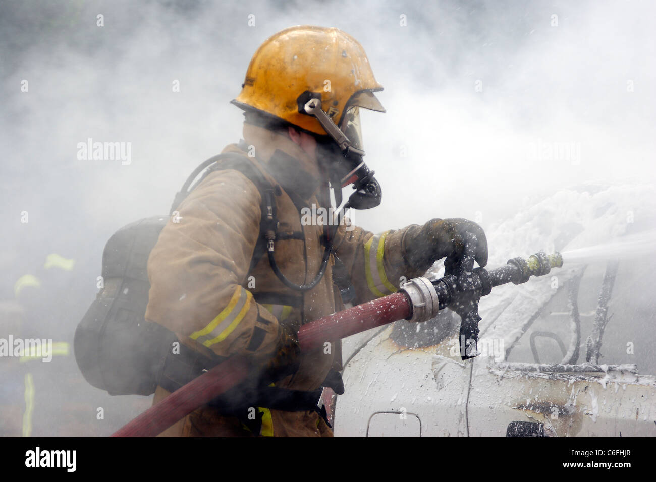 Fireman uses CAFS to extinguish a car fire Stock Photo - Alamy