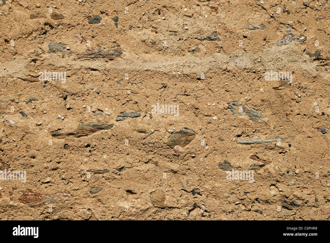 old tan plastered building wall that is becoming worn Stock Photo - Alamy