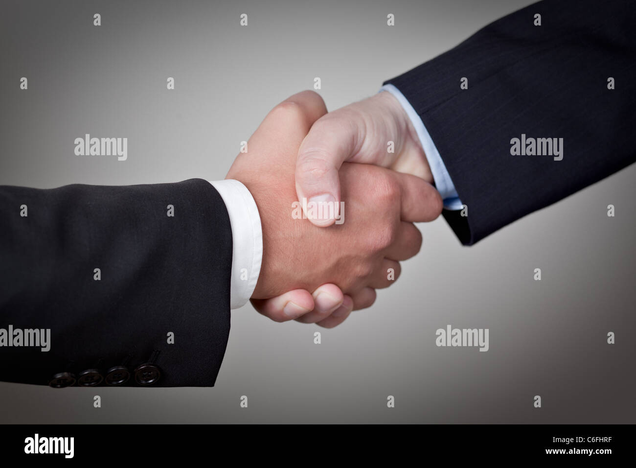 Two Businessman shake their hands on successful Deal Stock Photo - Alamy