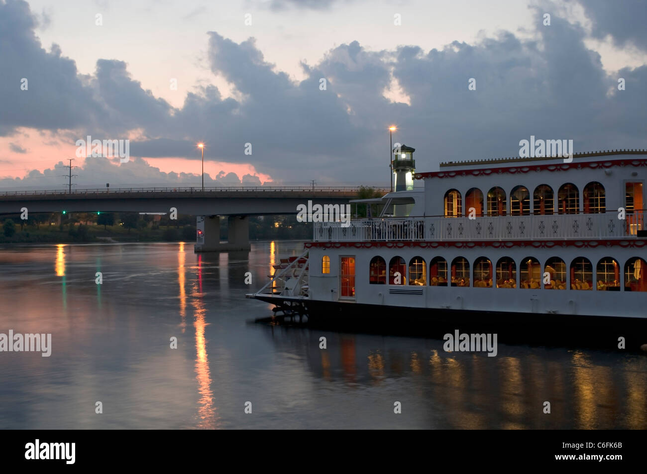 riverboat on mississippi river docked on Boom Island at dusk with ...