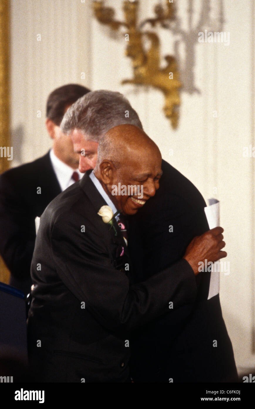 President Bill Clinton hugs Herman Shaw, a survivor of the Tuskegee ...