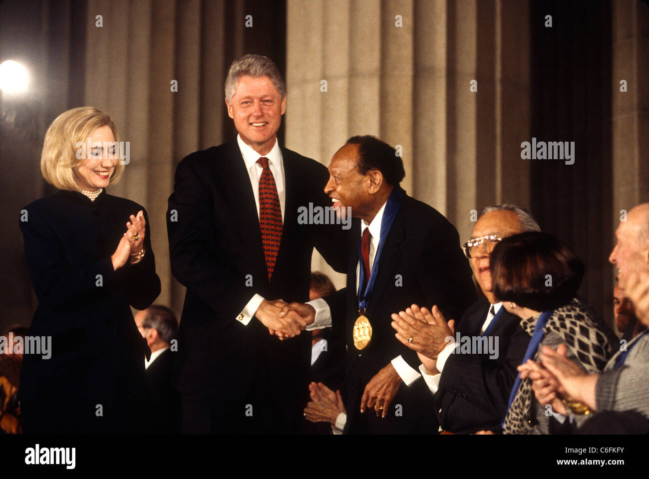 President Bill Clinton shakes hands with jazz legend Lionel Hampton ...
