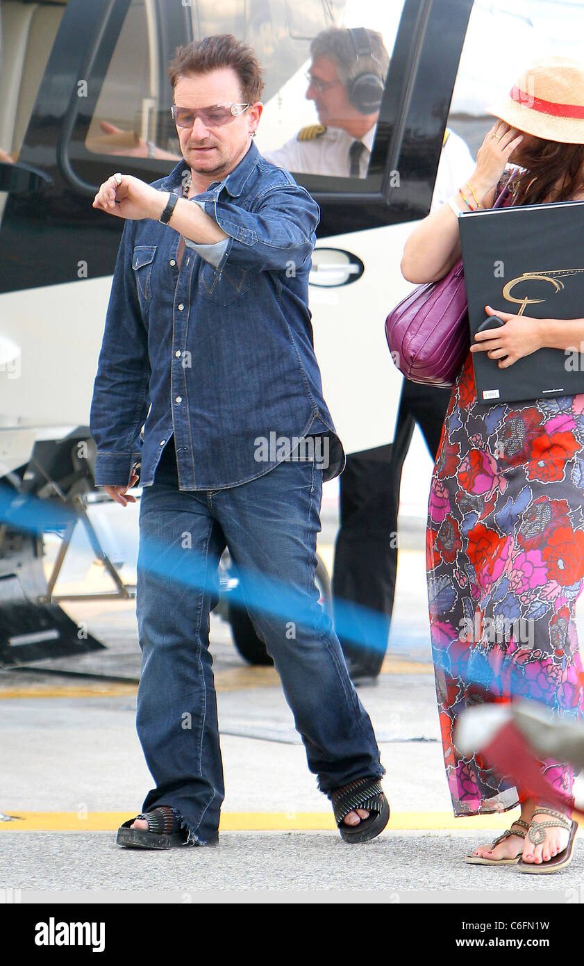 Singer Bono of U2, arriving to Monaco airport by helicopter. Bono is ...