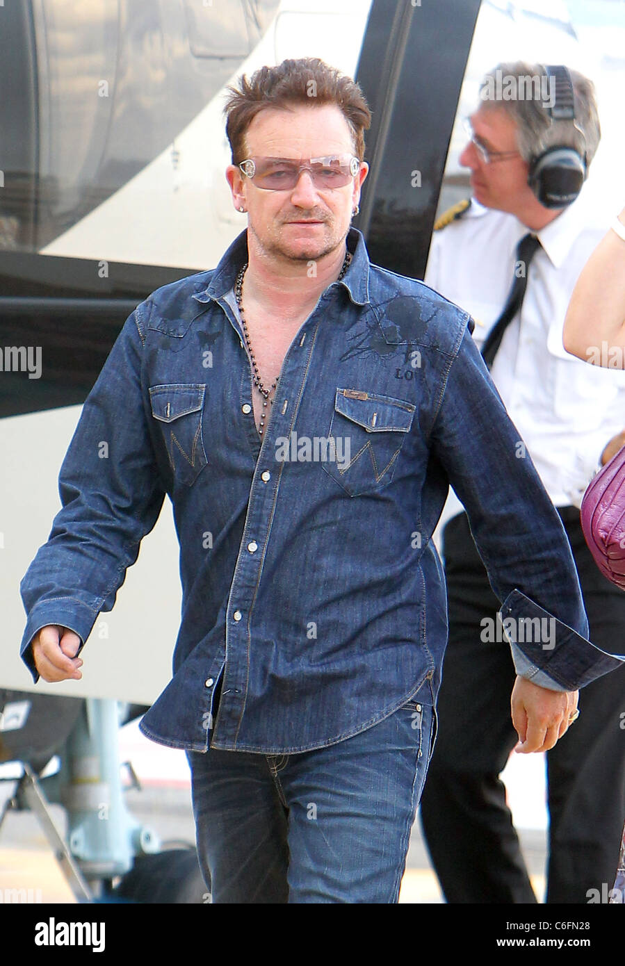 Singer Bono of U2, arriving to Monaco airport by helicopter. Bono is ...