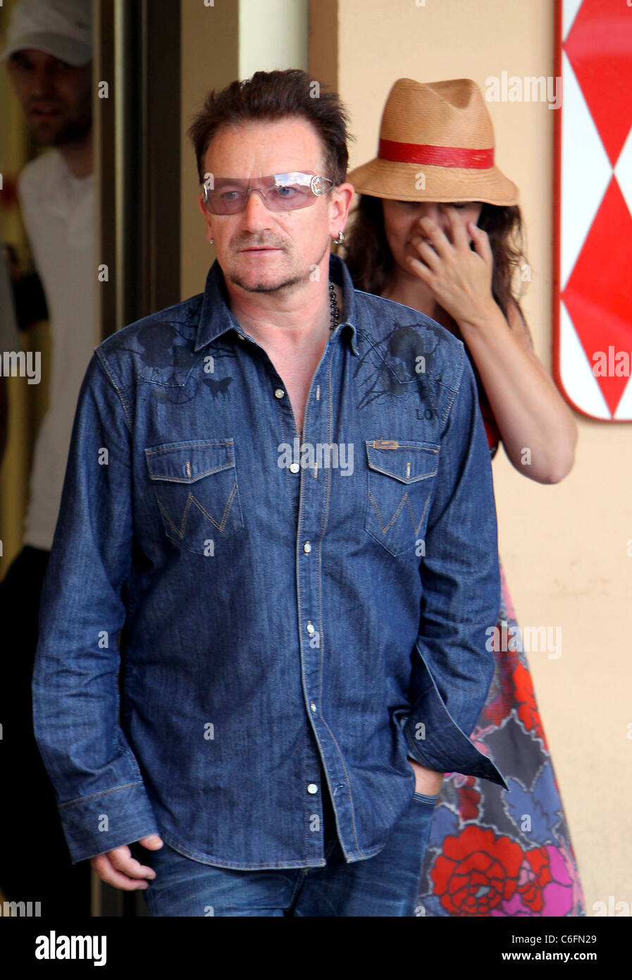 Singer Bono of U2, arriving to Monaco airport by helicopter. Bono is ...