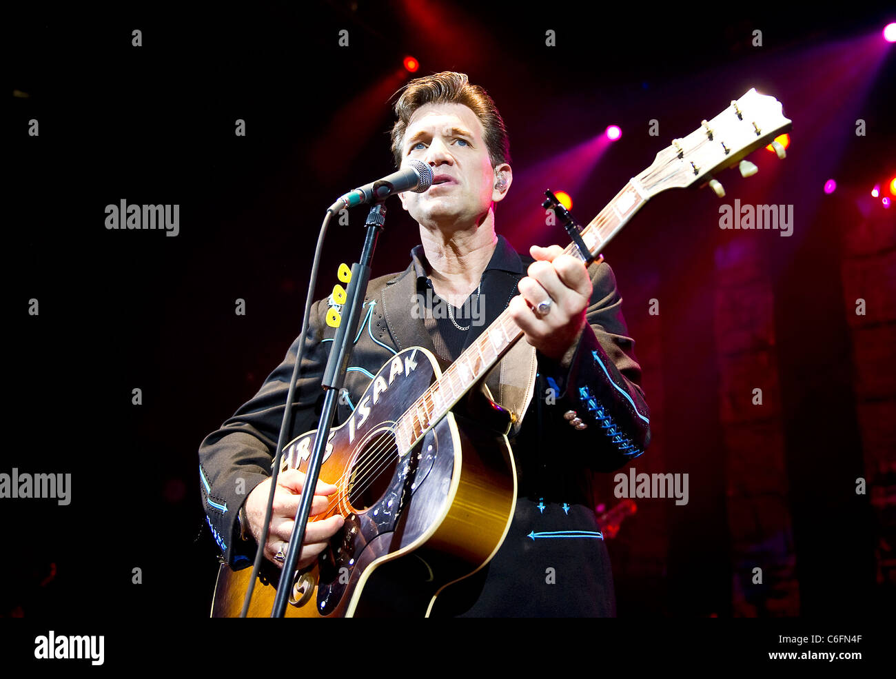 Singer Chris Isaak performing on stage during a concert Shepherds Bush ...